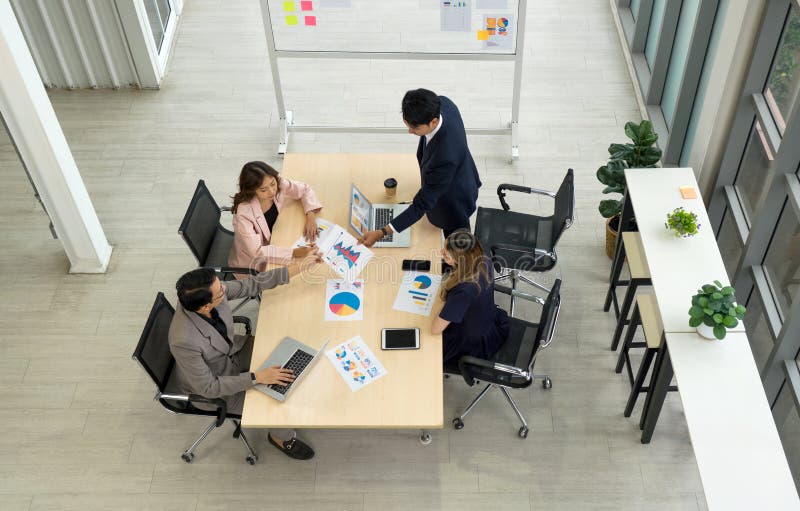 High-powered Business Professional Discussing Strategic Plan and Making ...