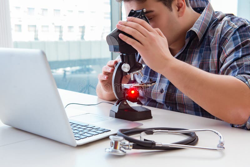 The High Precision Engineering with Man Working with Microscope Stock ...