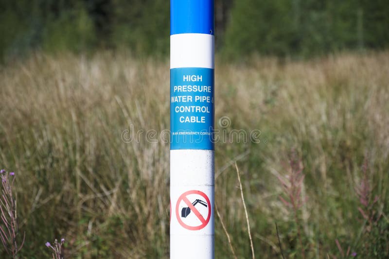 High Pressure Water Pipe Sign on White Pole Stock Photo - Image of ...