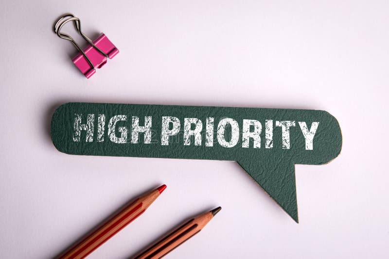 High Priority. Green Speech Bubble on White Office Desk Stock Photo ...