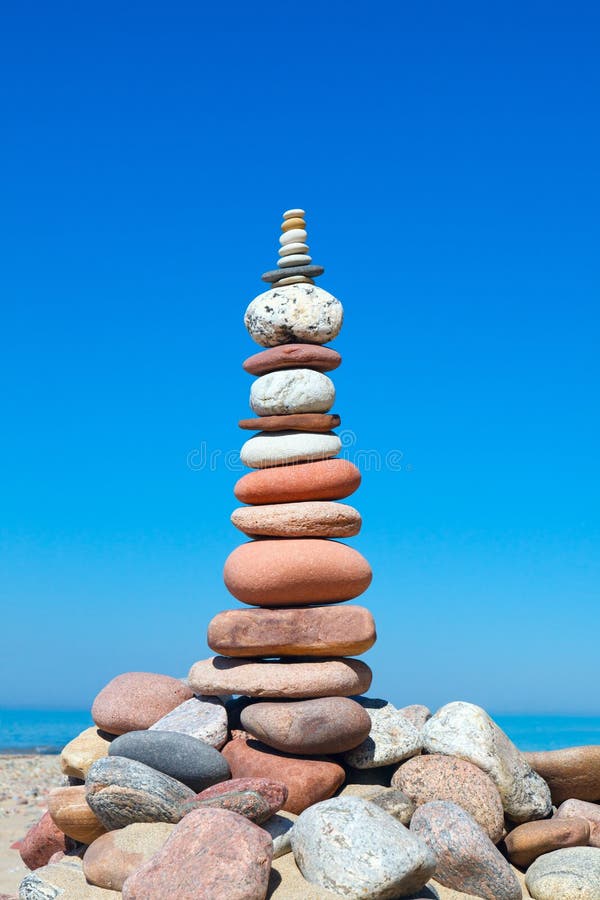 High Pyramid of Stones of Different Colors on the Background of Sea and ...