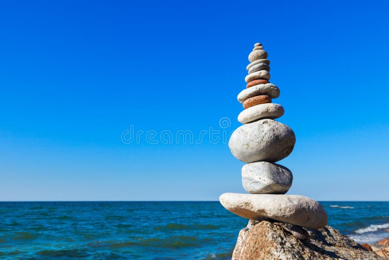 High Pyramid of Stones of Different Colors on the Background of Sea and ...