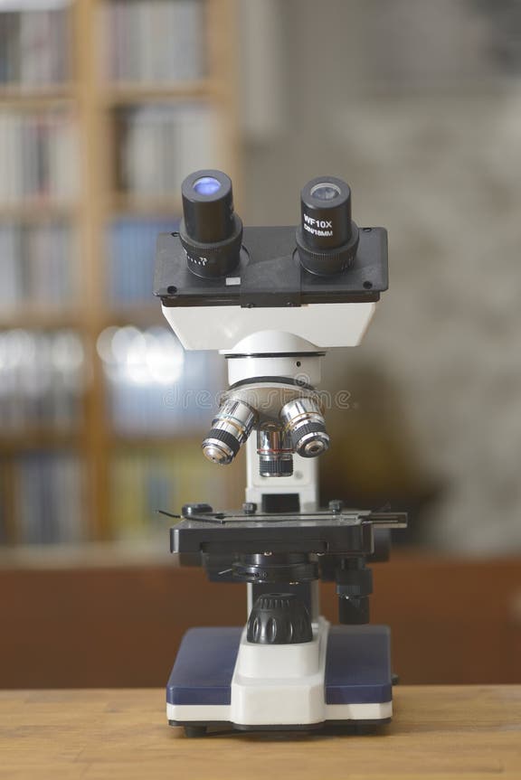 High-Quality Binocular Microscope on a Wooden Table in a Laboratory or ...