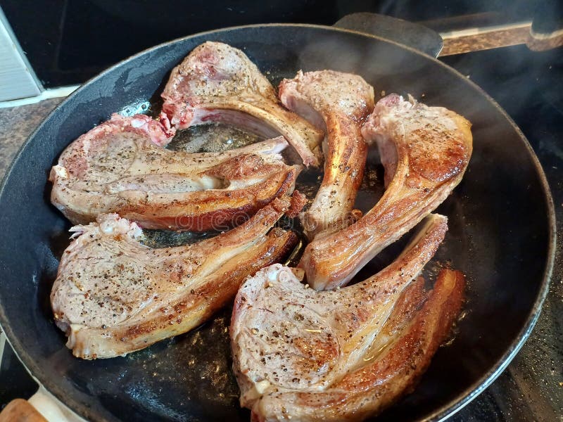 High Quality Top and Lamp Chops Cooked in an Ironcast Pan Stock Image ...