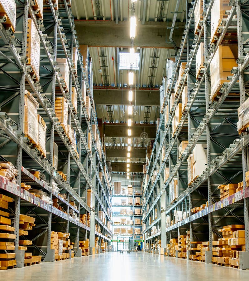 High Racks in the Aisle in a Large Warehouse Vertical View Stock Photo ...