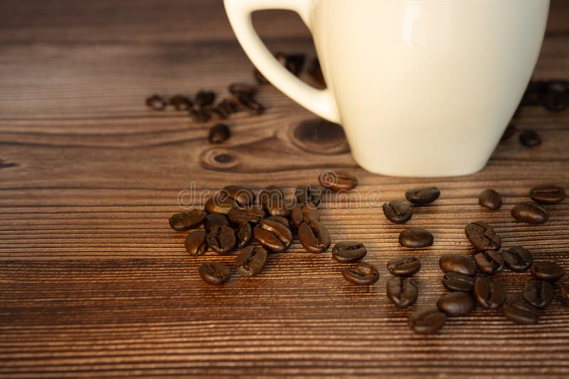 High Resolution of Coffee Grains on a Table Near a Coffee Cup Stock ...
