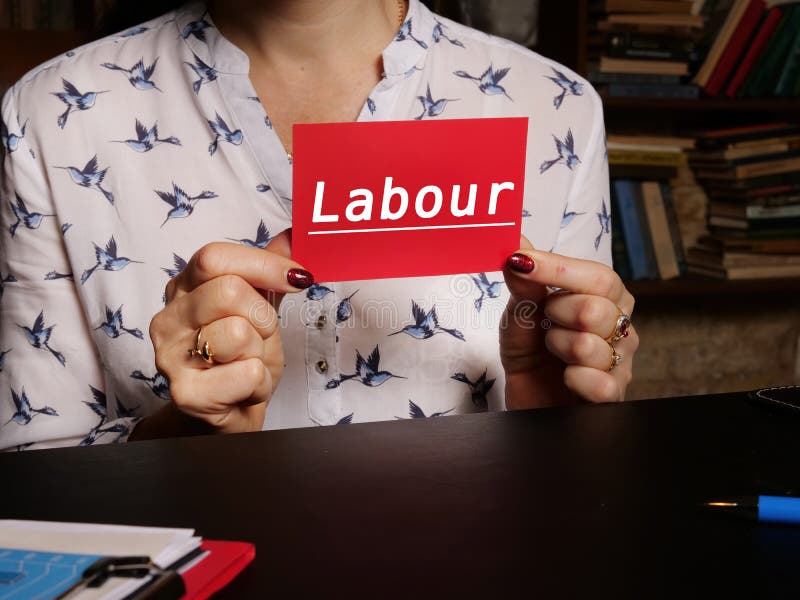 High Resolution Hand Holding Red Card with Written Text Labour ...