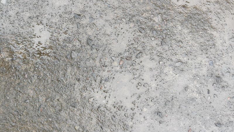 A High-resolution Image of a Wet Concrete Floor with a Reflective ...