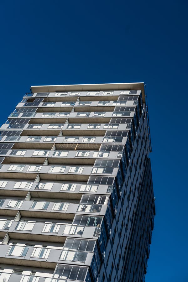 High Rise Apartment Building Against Blue Sky.. Stock Photo - Image of ...
