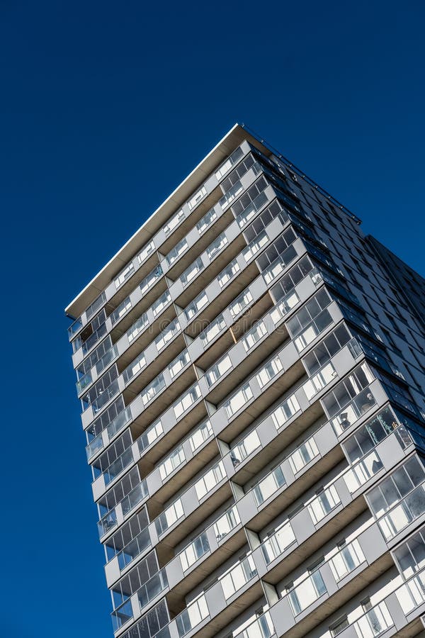 High Rise Apartment Building Against Blue Sky.. Stock Photo - Image of ...