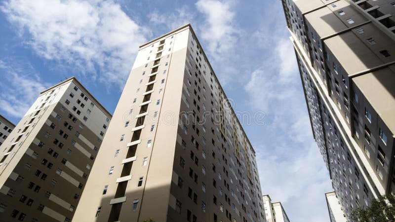High Rise Apartment Building Complex with Blue Sky Stock Image - Image ...