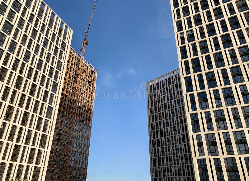 High-rise Building on a Background of Blue Sky. Tall New Building with ...