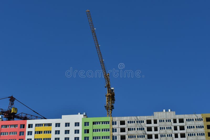 A High-rise Building is Being Built Using a Tower Crane Stock Image ...