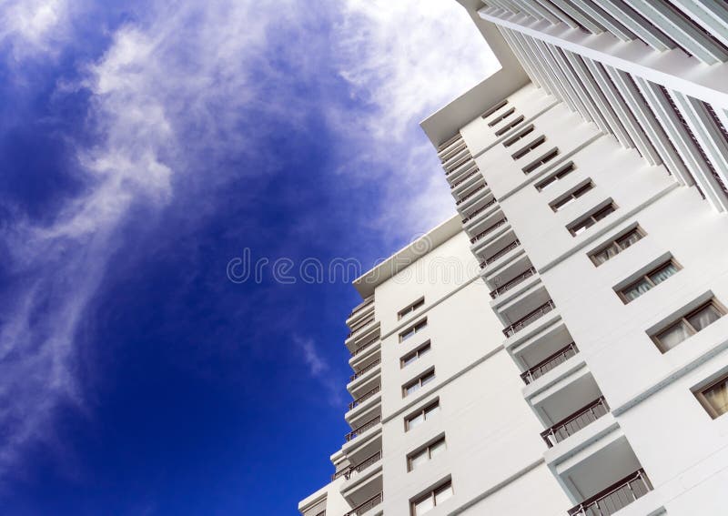 High Rise Building and Bright Blue Sky Stock Photo - Image of rise ...