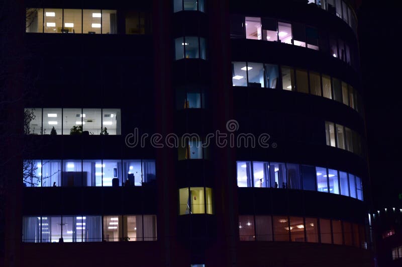 High-rise Building Illuminated by Numerous Windows at Night. Stock ...