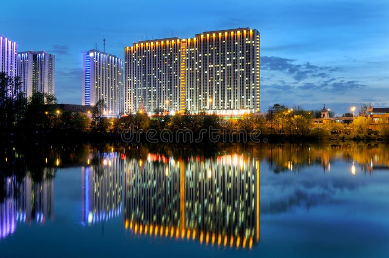 High-rise Building and Its Reflection in Water Stock Image - Image of ...