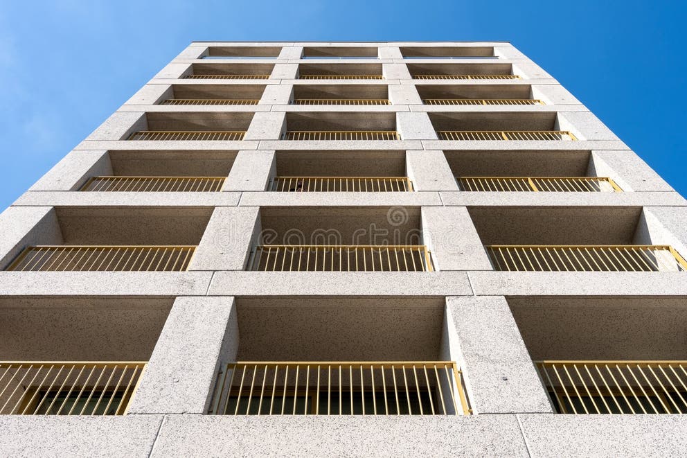 Modern Concrete Apartment in Poland with Yellow Railings and Repeating ...