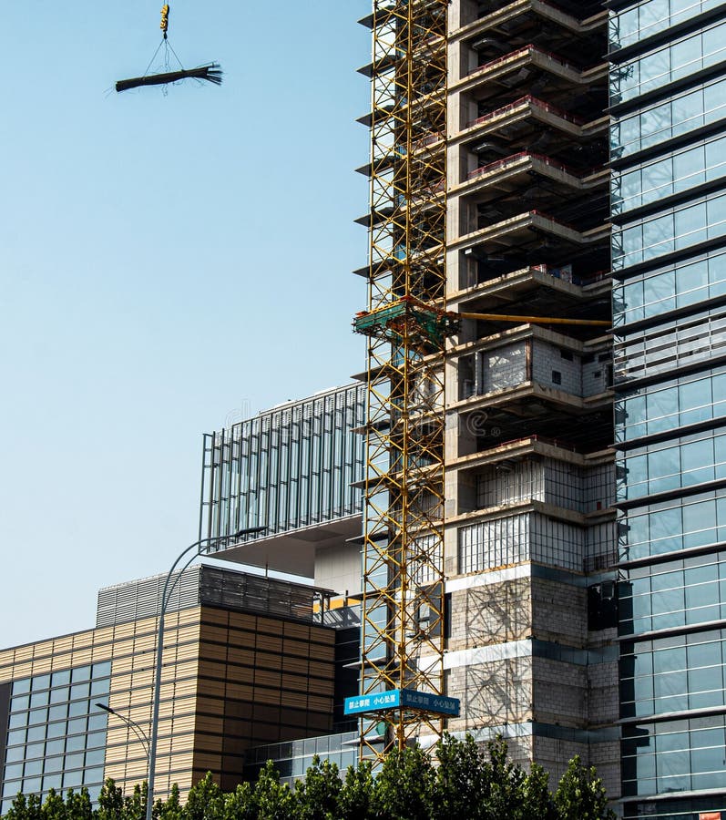 High-rise Building Under Construction with Crane Stock Photo - Image of ...