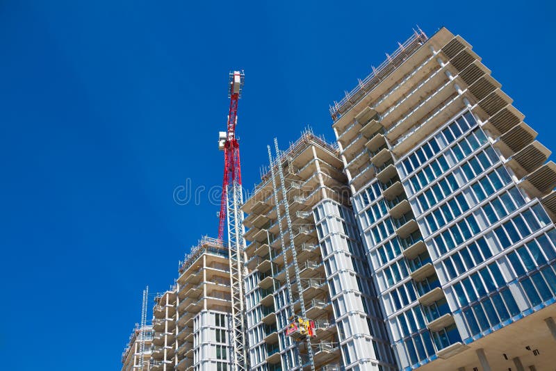High-rise Building Under Construction. the Site with Cranes Against ...