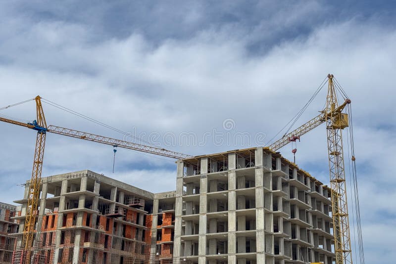 High Rise Building Under Construction Two Large Yellow Tower Cranes ...