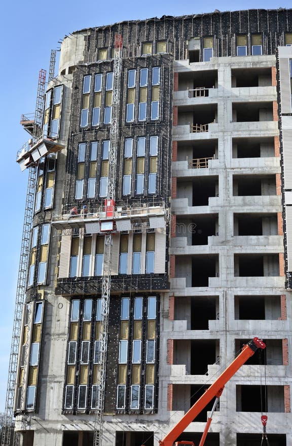 High-rise Building Under Construction with a Waterproofing and Warming ...