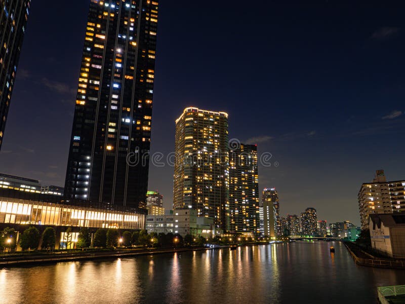 High Rise Buildings in Tokyo Reflected in a River Stock Image - Image ...