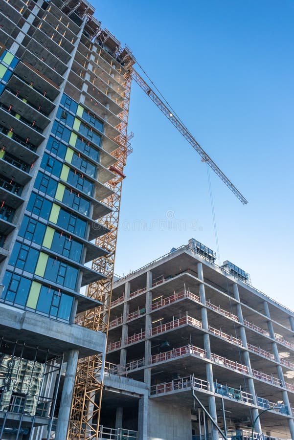 High-rise Buildings Under Construction on Blue Sky Background. Stock ...