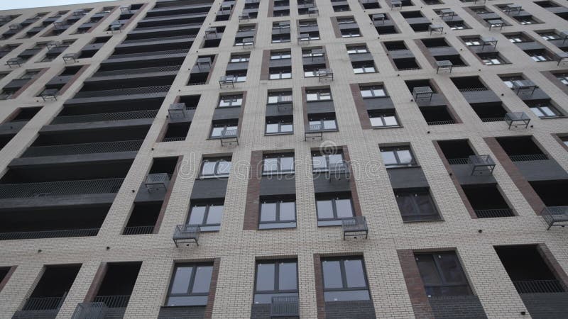 High-rise Features Facade with Grid of Windows and Balconies Stock ...