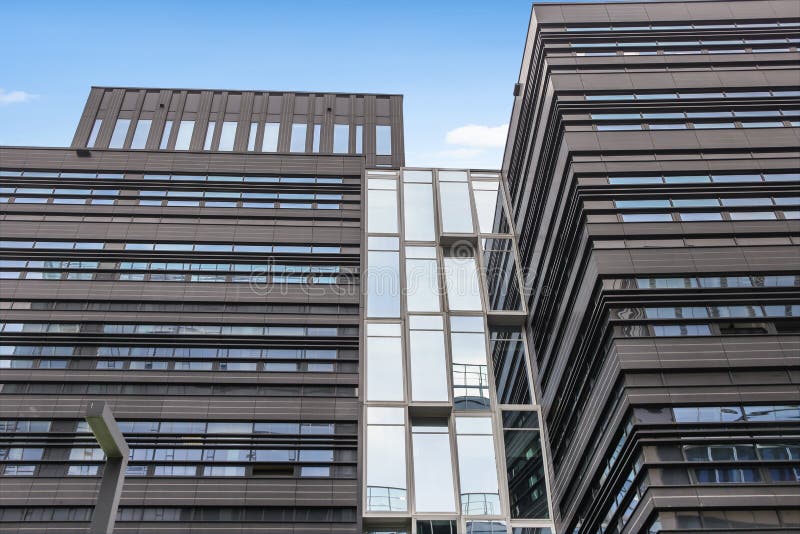 High-rise Glass Buildings Against Blue Clouds, Empty Space for Text ...