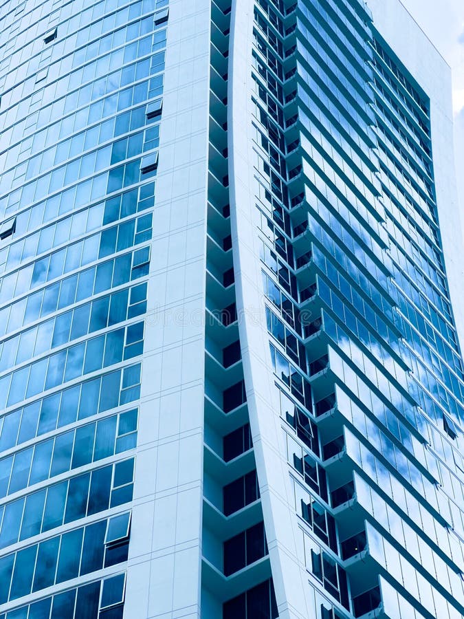 High-rise Modern Glass Building Reflecting the Blue Sky. Stock Photo ...