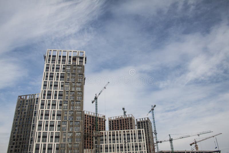 High-rise Multi-storey Buildings Under Construction. Tower Cranes Near ...