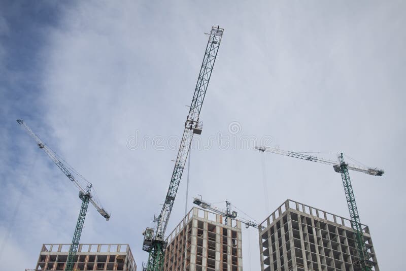 High-rise Multi-storey Buildings Under Construction. Tower Cranes Near ...