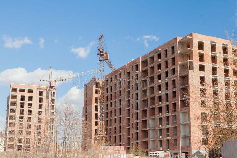 High-rise Multi-storey Buildings Under Construction. Tower Cranes Near ...