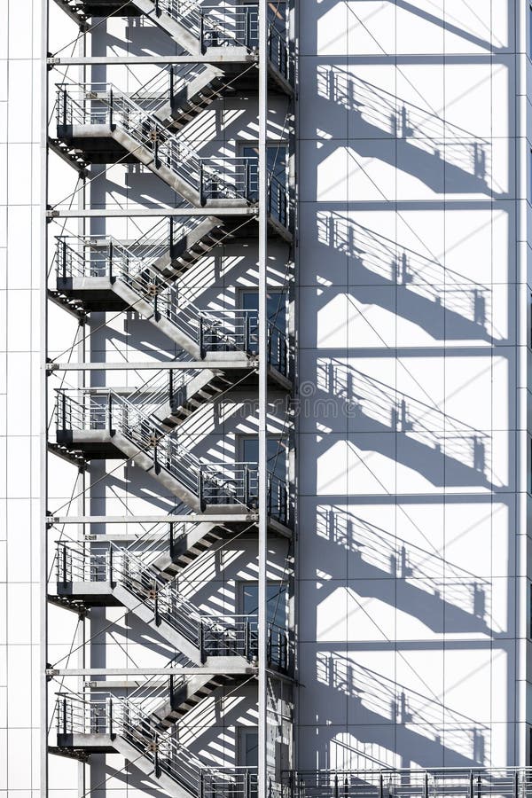 High Rise Office Building with Shadow of Metal Fire Escape Stock Photo ...