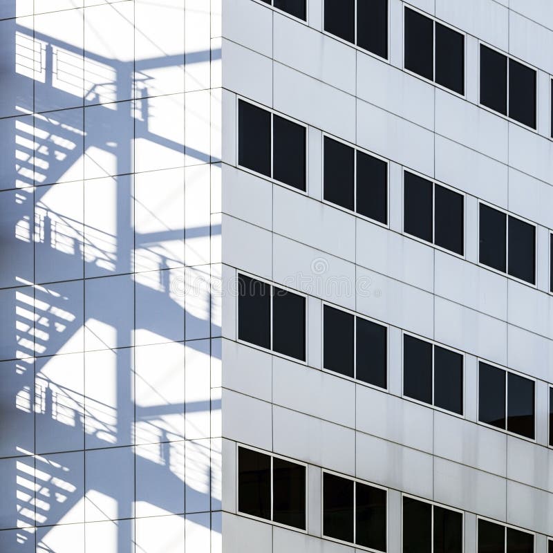 High Rise Office Building with Shadow of Metal Fire Escape Stock Photo ...