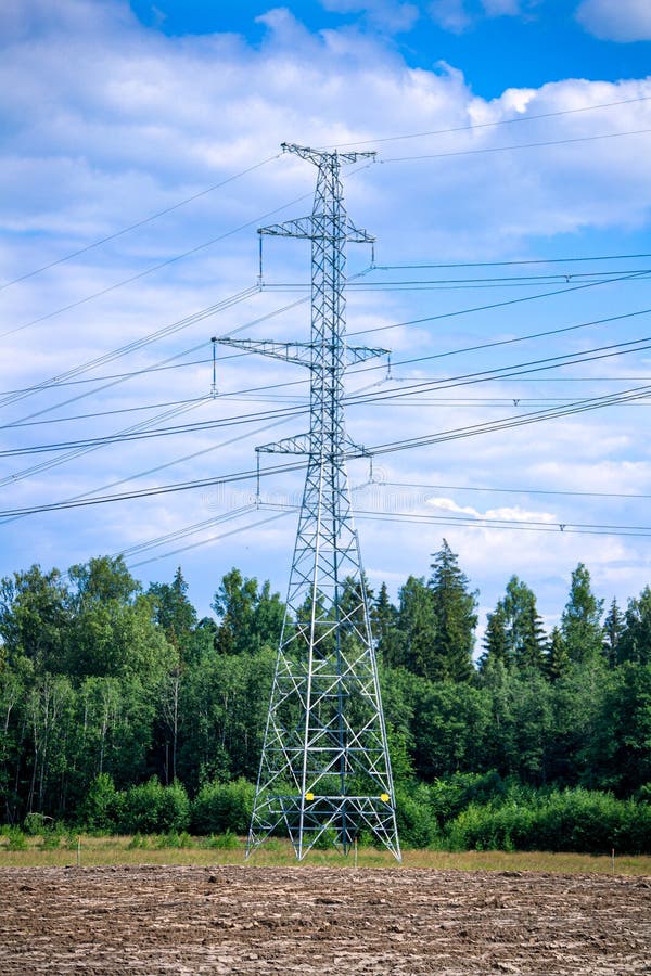 High-rise Power Transmission Tower in a Field with Wires. Stock Photo ...