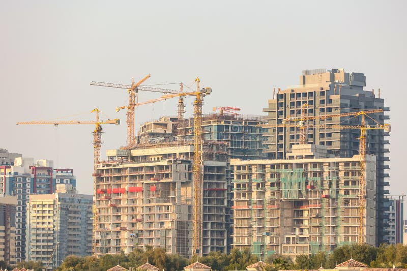 High-Rise Residential Buildings Under Construction with Tower Cranes ...