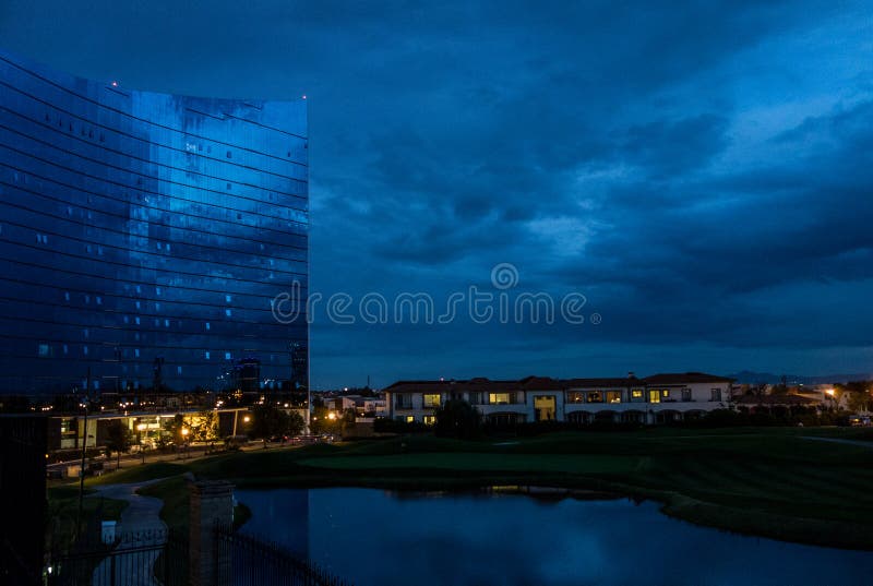 High Rise with Windows Mirroring Sky at Night Stock Photo - Image of ...
