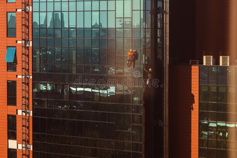 High-rise Workers Cleaning the Windows of a Skyscraper Stock Image ...