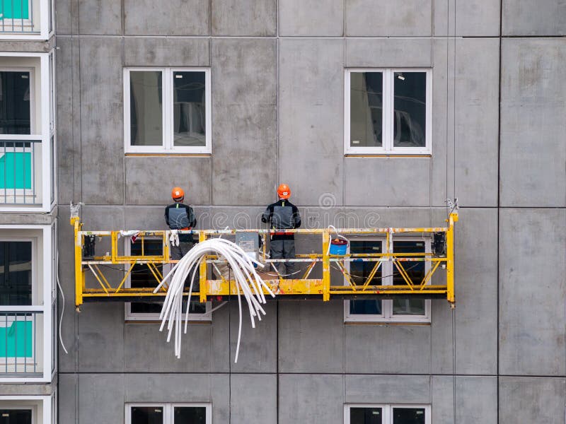 High-rise Workers Work on the Lift in the Construction of High-rise ...