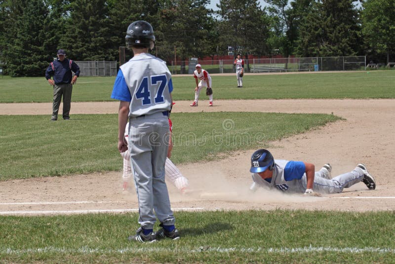 Baseball Coach Helping a Player Stock Photo - Image of footprints ...