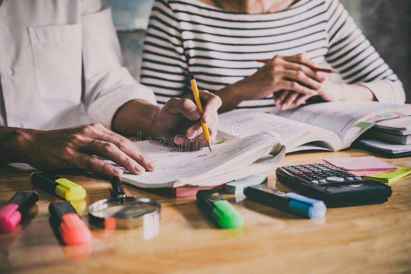 High School or College Asian Student Group Sitting at Desk in Cl Stock ...