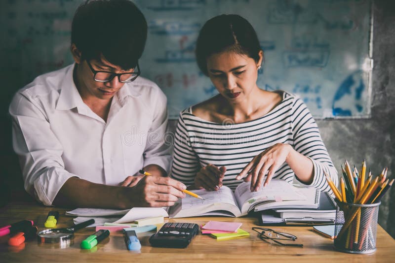 High School or College Asian Student Group Sitting at Desk in Cl Stock ...