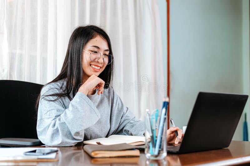 High School or College Student Learning Tutoring on Desk and Reading ...