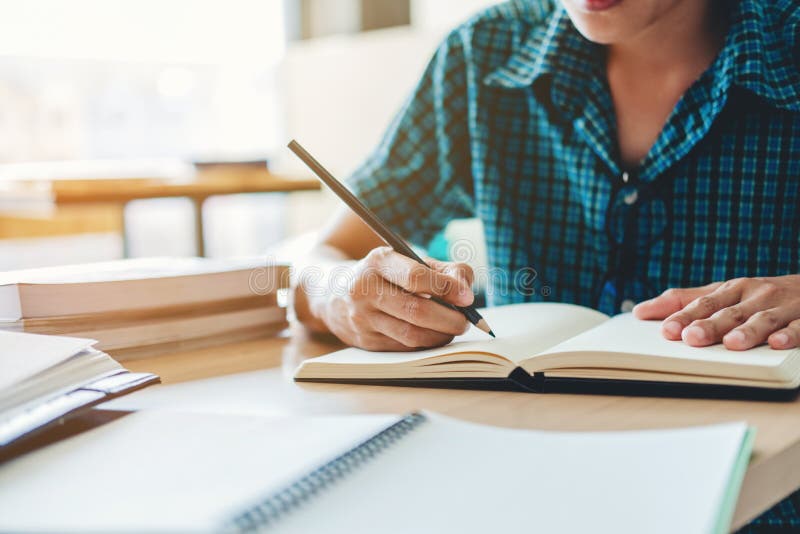 High School or College Student Studying and Reading Together in Stock ...