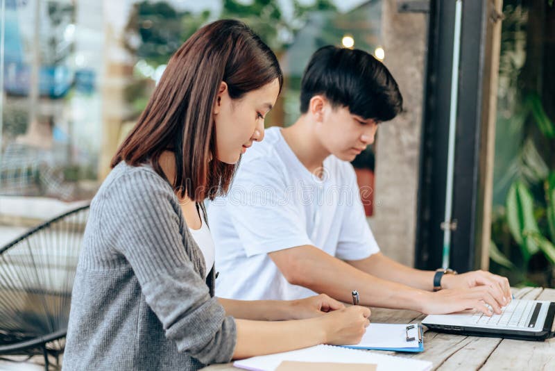 High School or College Students Group Catching Up Workbook and Learning ...