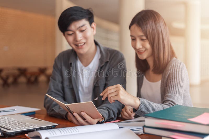 High School or College Students Group Catching Up Workbook and Learning ...
