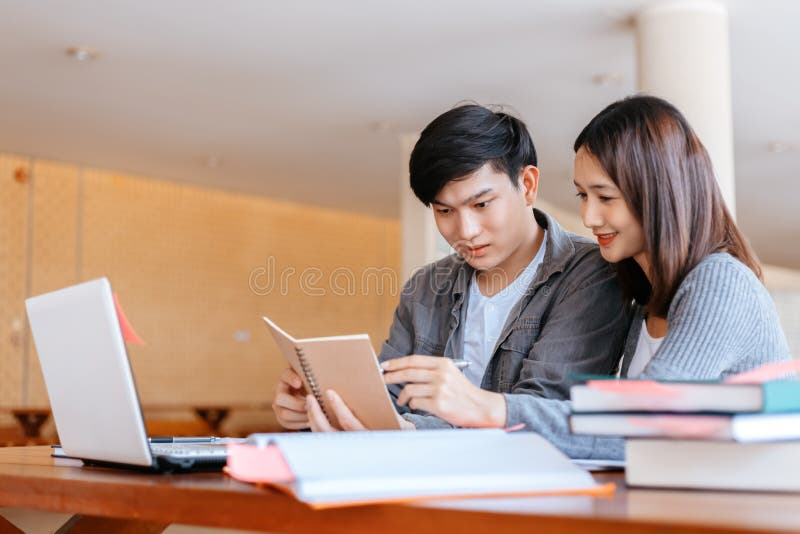 High School or College Students Group Catching Up Workbook and Learning ...