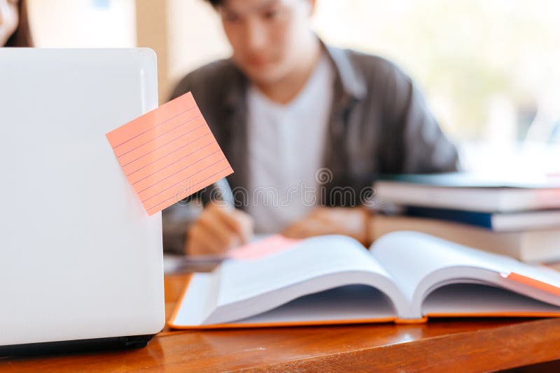 High School or College Students Group Catching Up Workbook and Learning ...