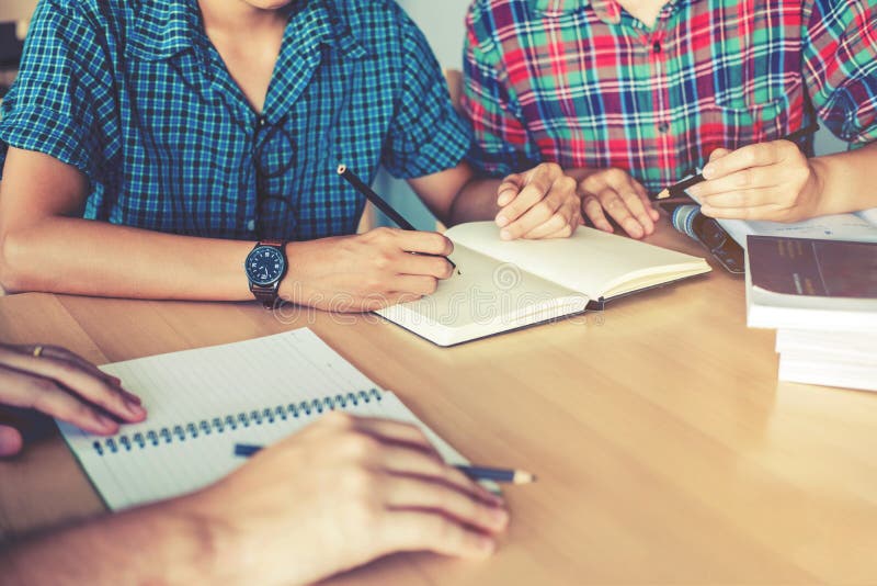 High School or College Students Studying and Reading Together in Stock ...